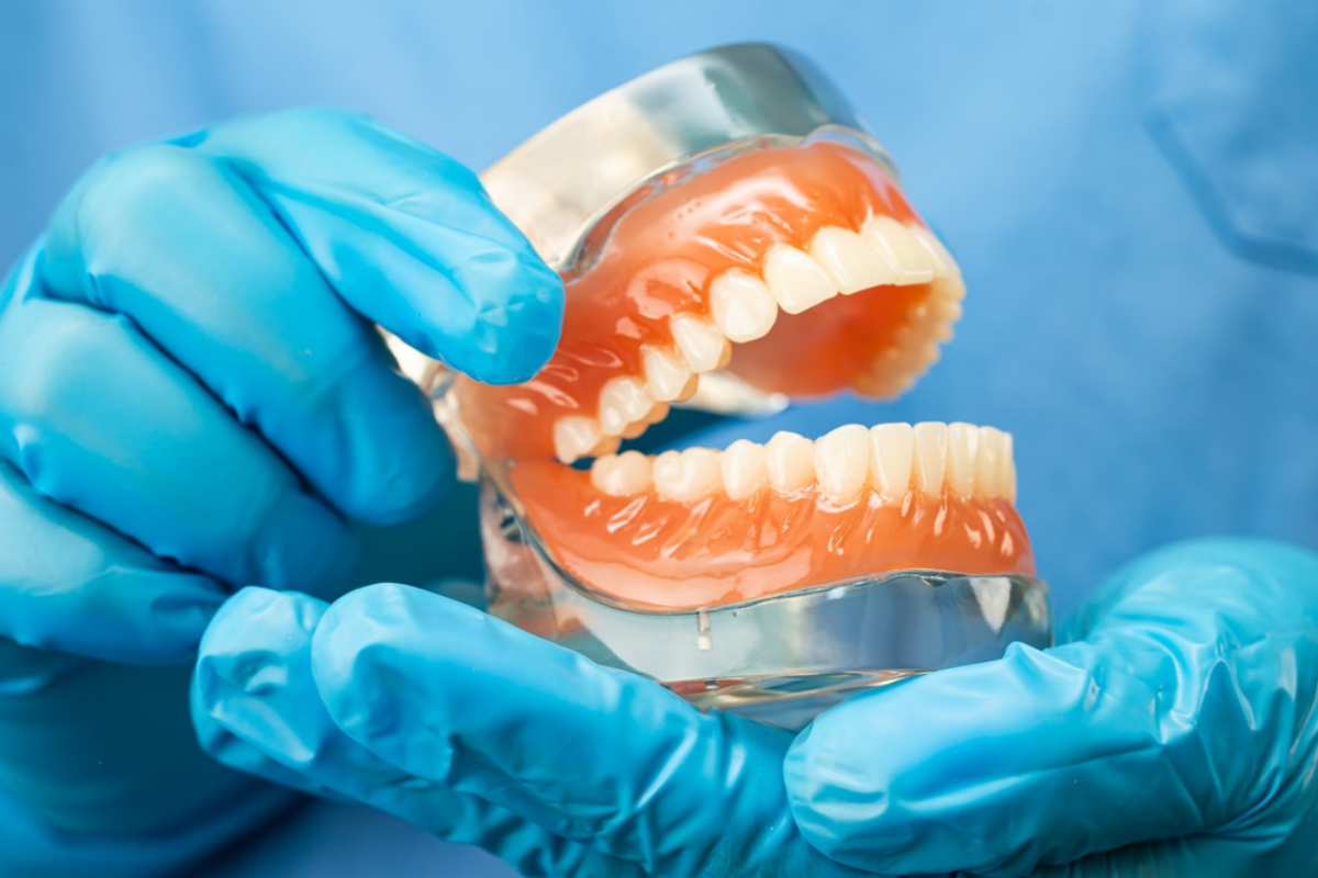 Transform Your Smile with Comfortable Implant Dentures